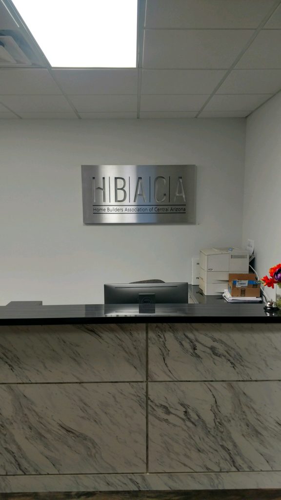 Examples of Custom Office Lobby Signs using varied materials